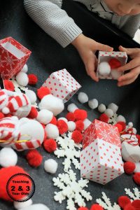 Pom Pom Snowman Sensory Bin that Builds Fine Motor Skills